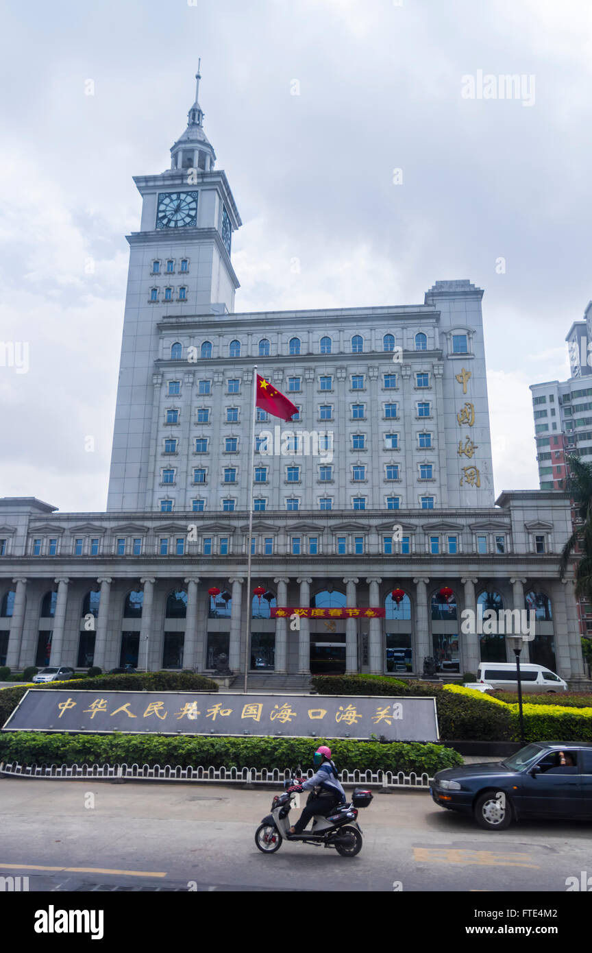Haikou Customs Building with clock tower and flag of China in downtown ...