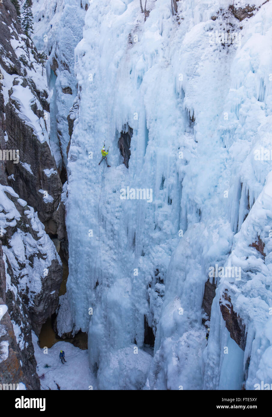 Ice climber climbing a route called Pick o' Vic which is rated WI4 in ...