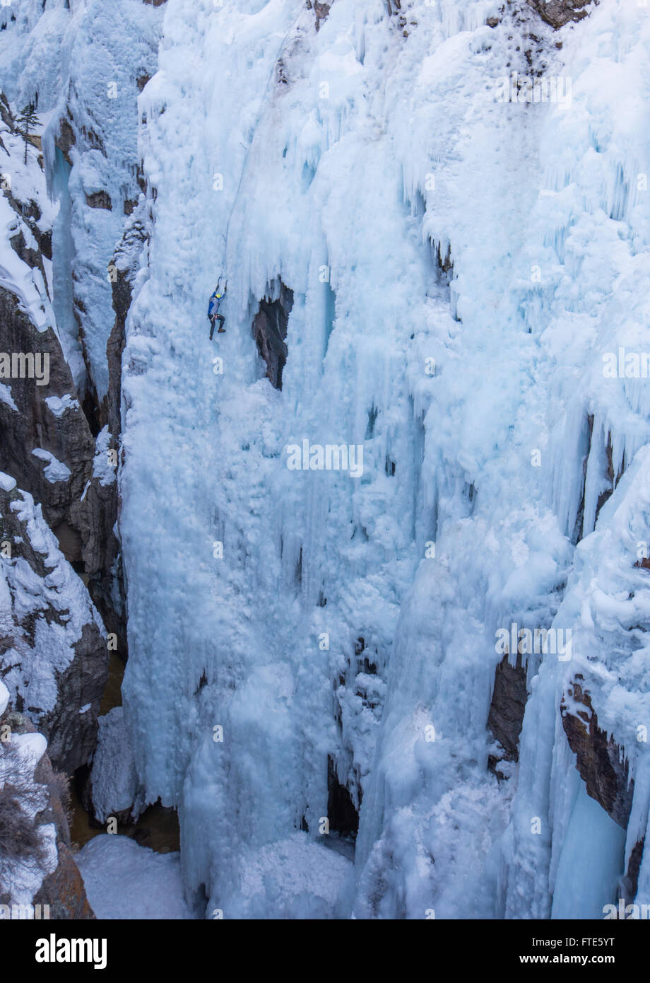 Ice climber climbing a route called Pick o' Vic which is rated WI4 in ...
