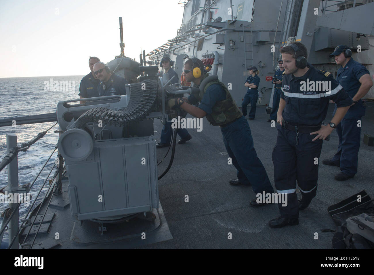 A Sailor from the French Navy observes Gunner's Mate 2nd Class Gregory ...