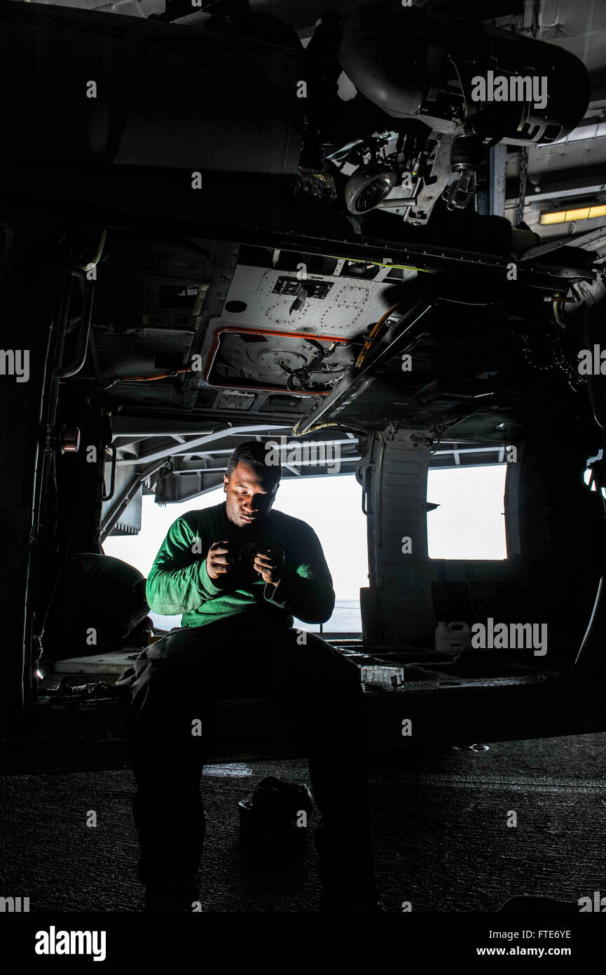 Aviation Structural Mechanic 3rd Class Brandon Stinson performs ...