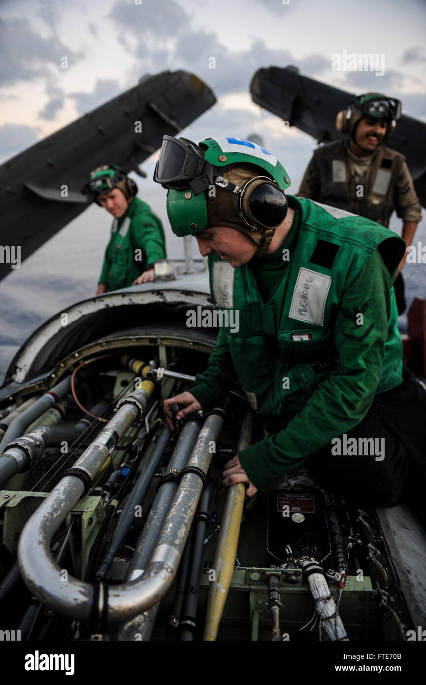 Aviation Machinist’s Mate 3rd Class Garrett Moss, front, performs ...