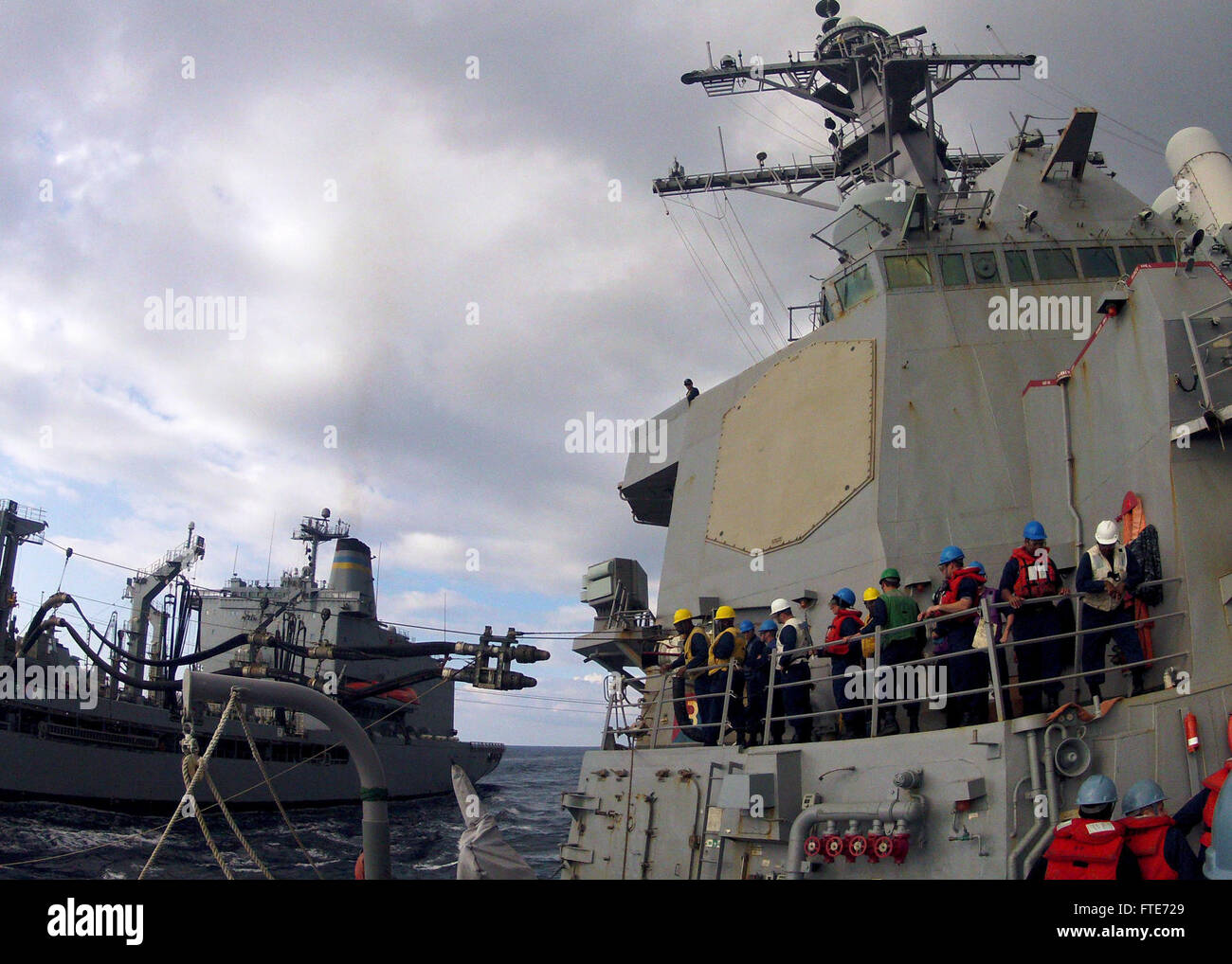 This U.S. Navy photo captures the USS Ramage (DDG 61), a guided-missile ...