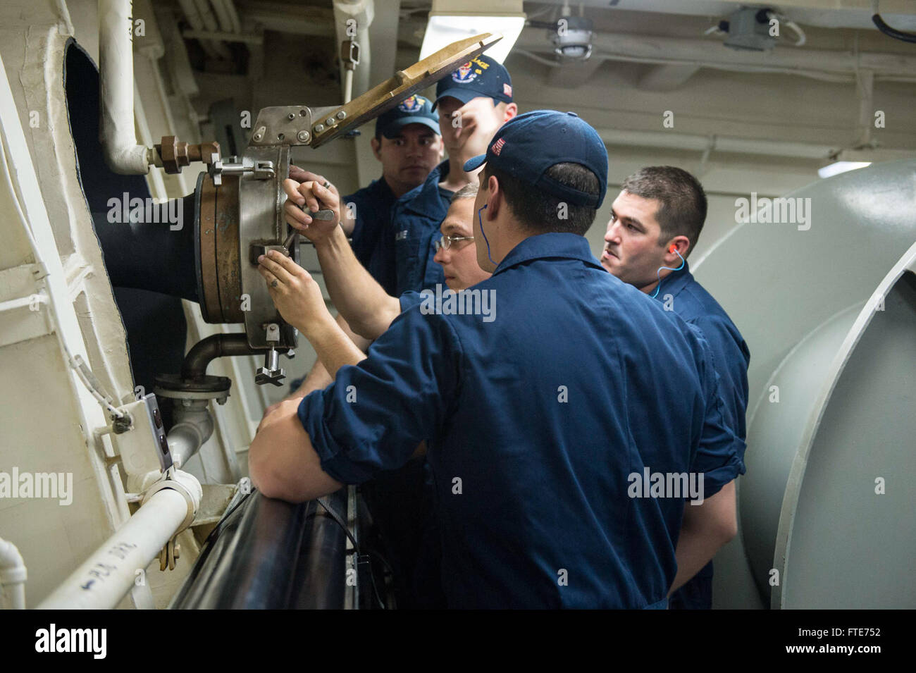 Sailors aboard the USS Ramage (DDG 61) conduct a training exercise in ...