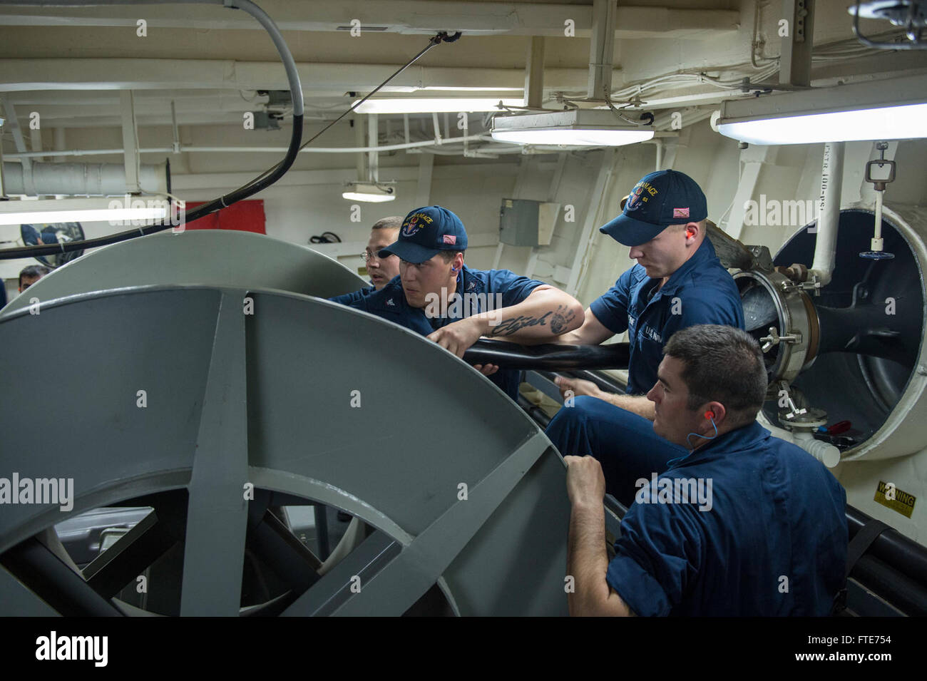 Sailors aboard the USS Ramage (DDG 61) conduct a training exercise with ...