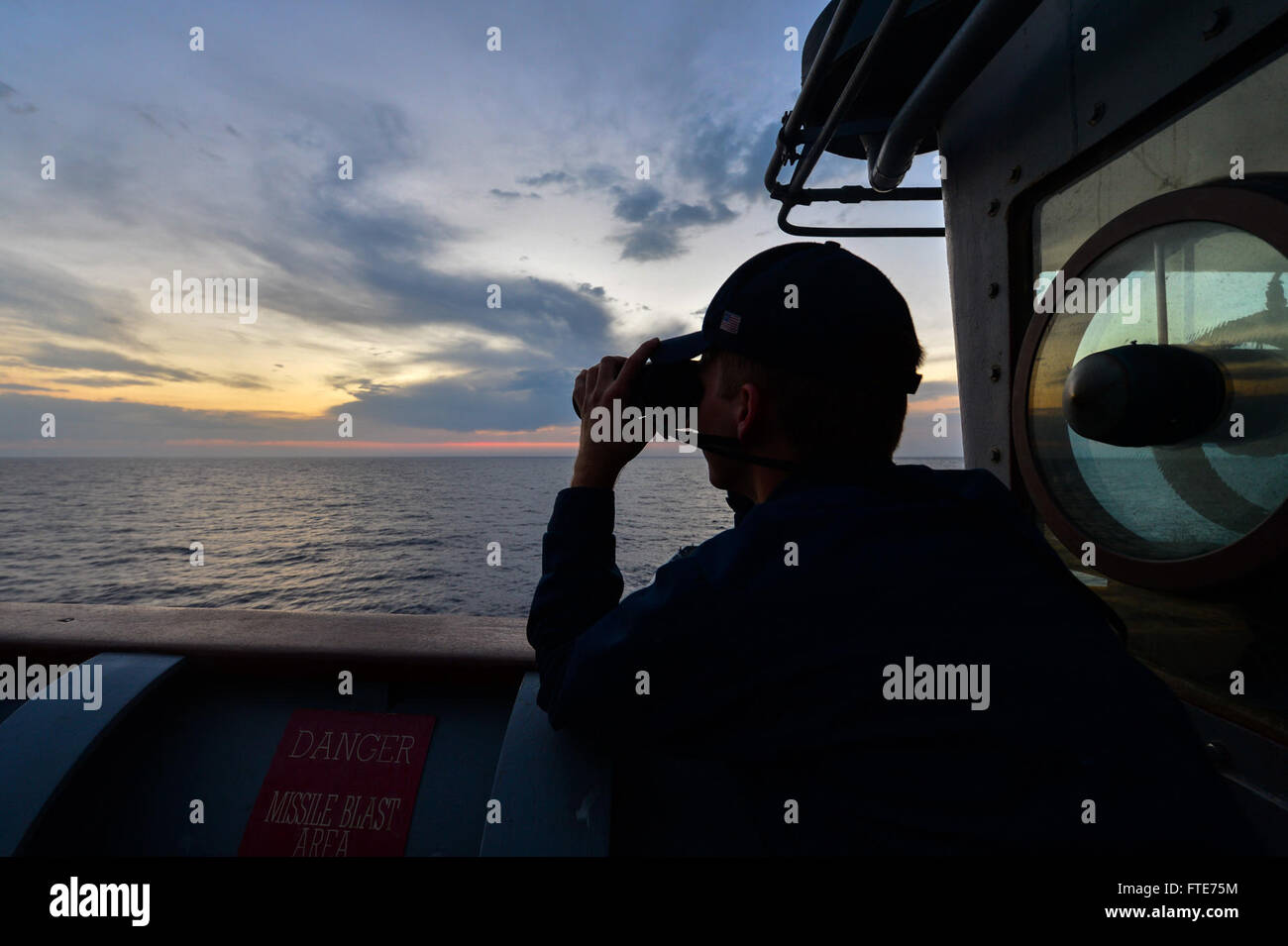 On October 30, 2013, Seaman Apprentice Jacob Delfino stood watch on the ...