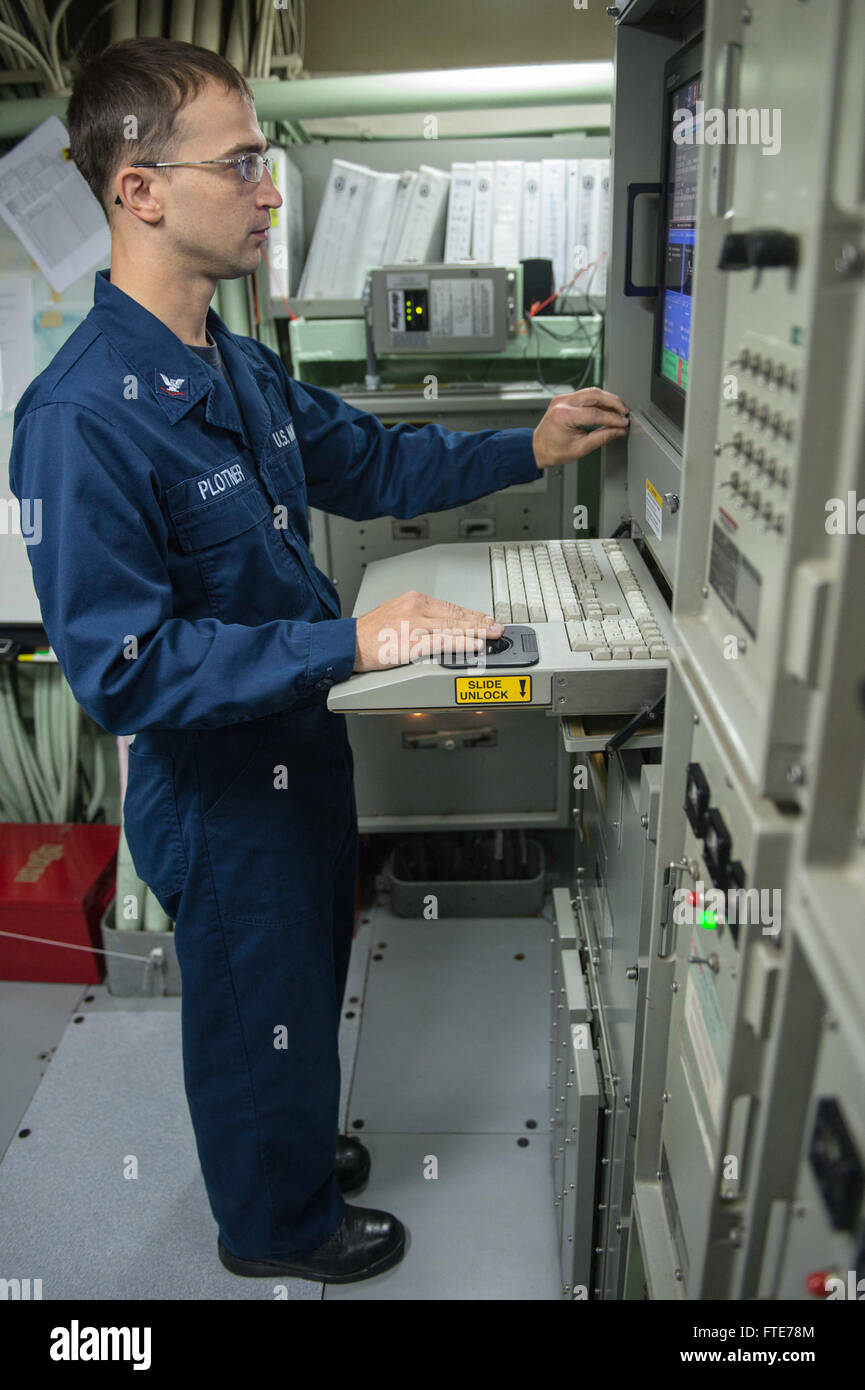 This photograph captures Fire Controlman 3rd Class Travis Plotner ...