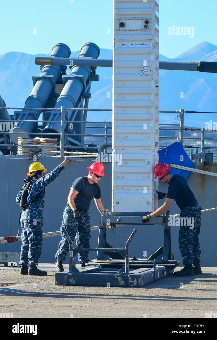 The image shows sailors aboard the USS Monterey (CG 61) and USS Ramage ...