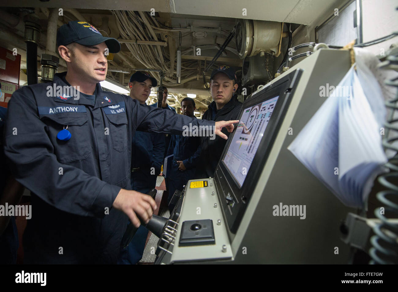 Machinist's Mate 2nd Class Karl Anthony provides aft steering helmsman ...