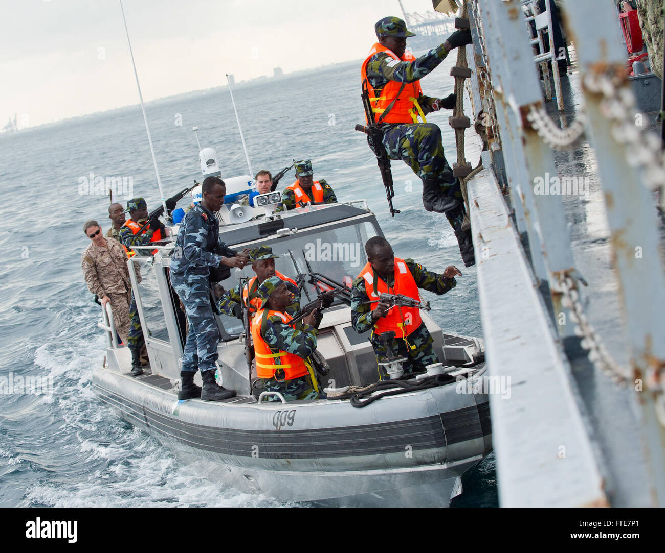 Members of the Uganda People's Defence Force board a target vessel ...