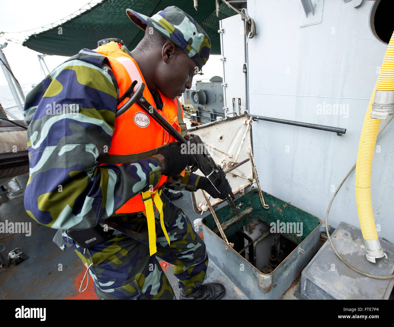 The image captures a member of the Uganda People's Defence Force ...