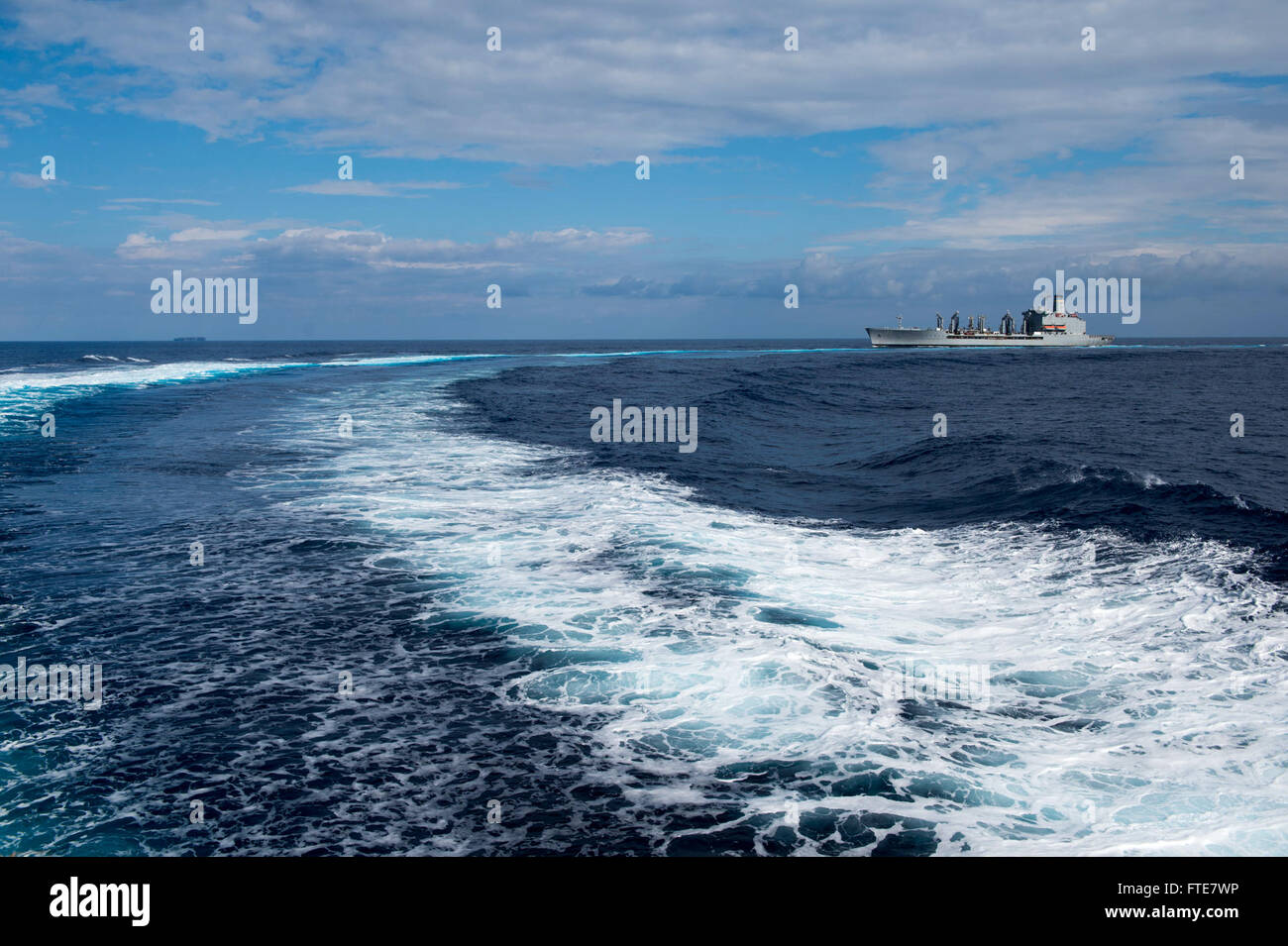 The photograph shows the USNS Leroy Grumman, a fleet replenishment ...