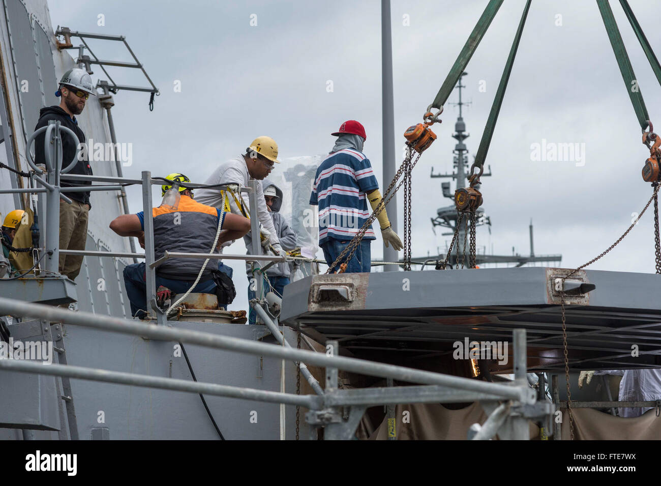 Civilian contractors install a platform for a Mk-59 decoy system on the ...