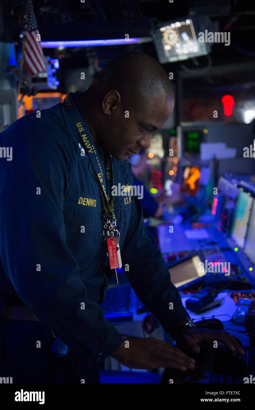 Lieutenant Shaun Dennis, Tactical Action Officer aboard the USS Stout ...