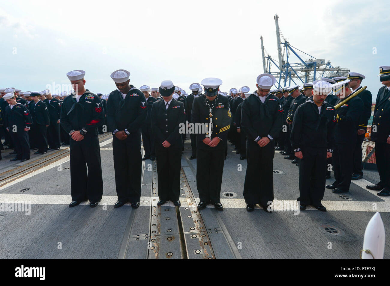 Sailors aboard the USS Monterey (CG 61) participate in a change of ...