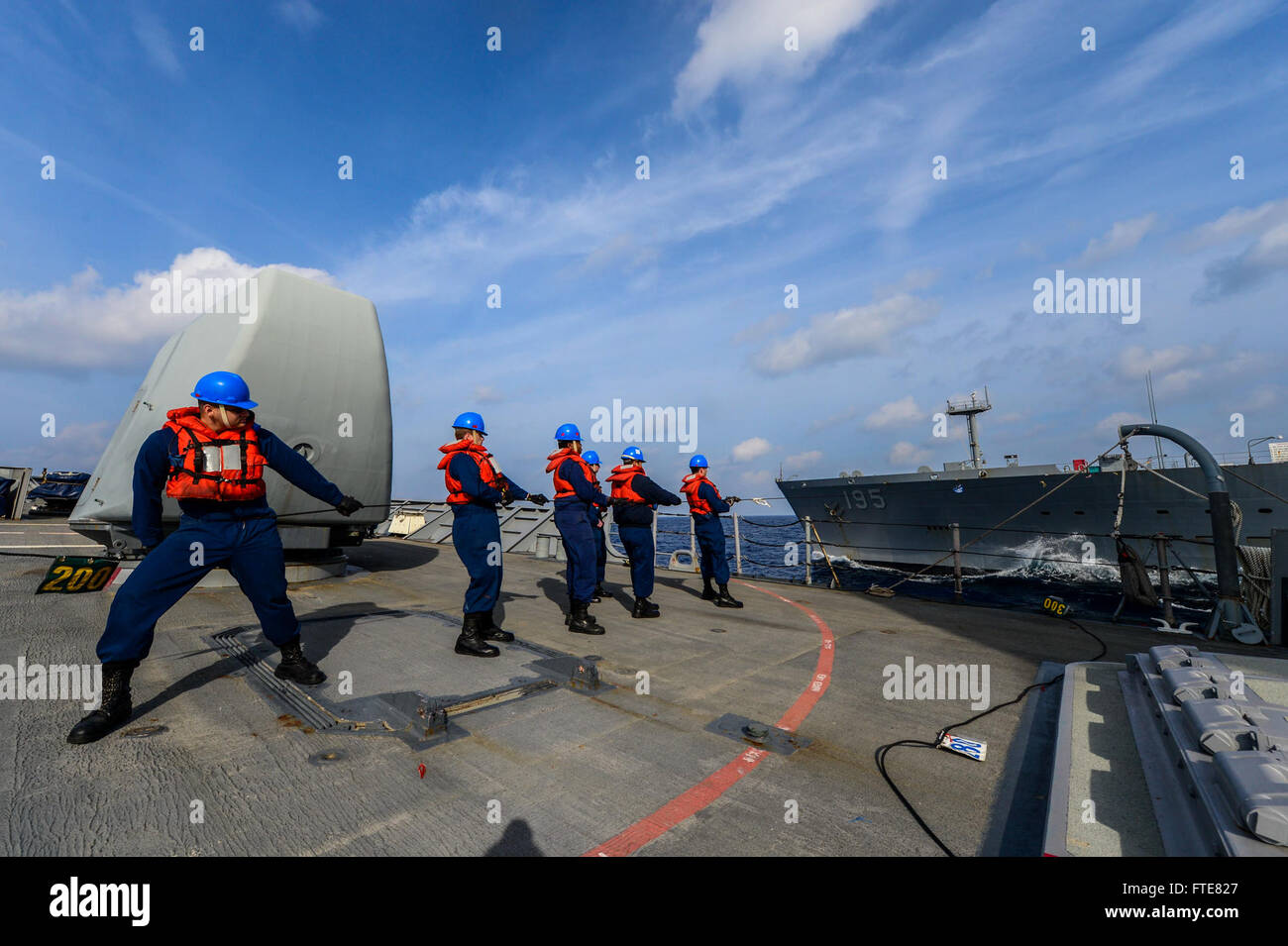U.S. Navy sailors aboard the USS Monterey (CG 61) conduct replenishment ...