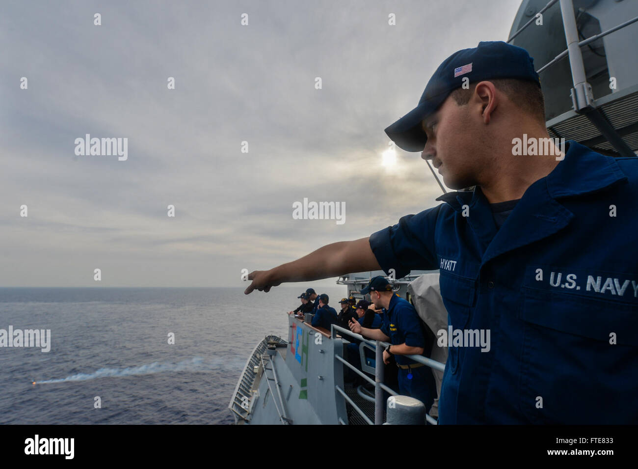 This photo shows Seaman Recruit Thomas Hyatt pointing at a Mk-58 smoke ...