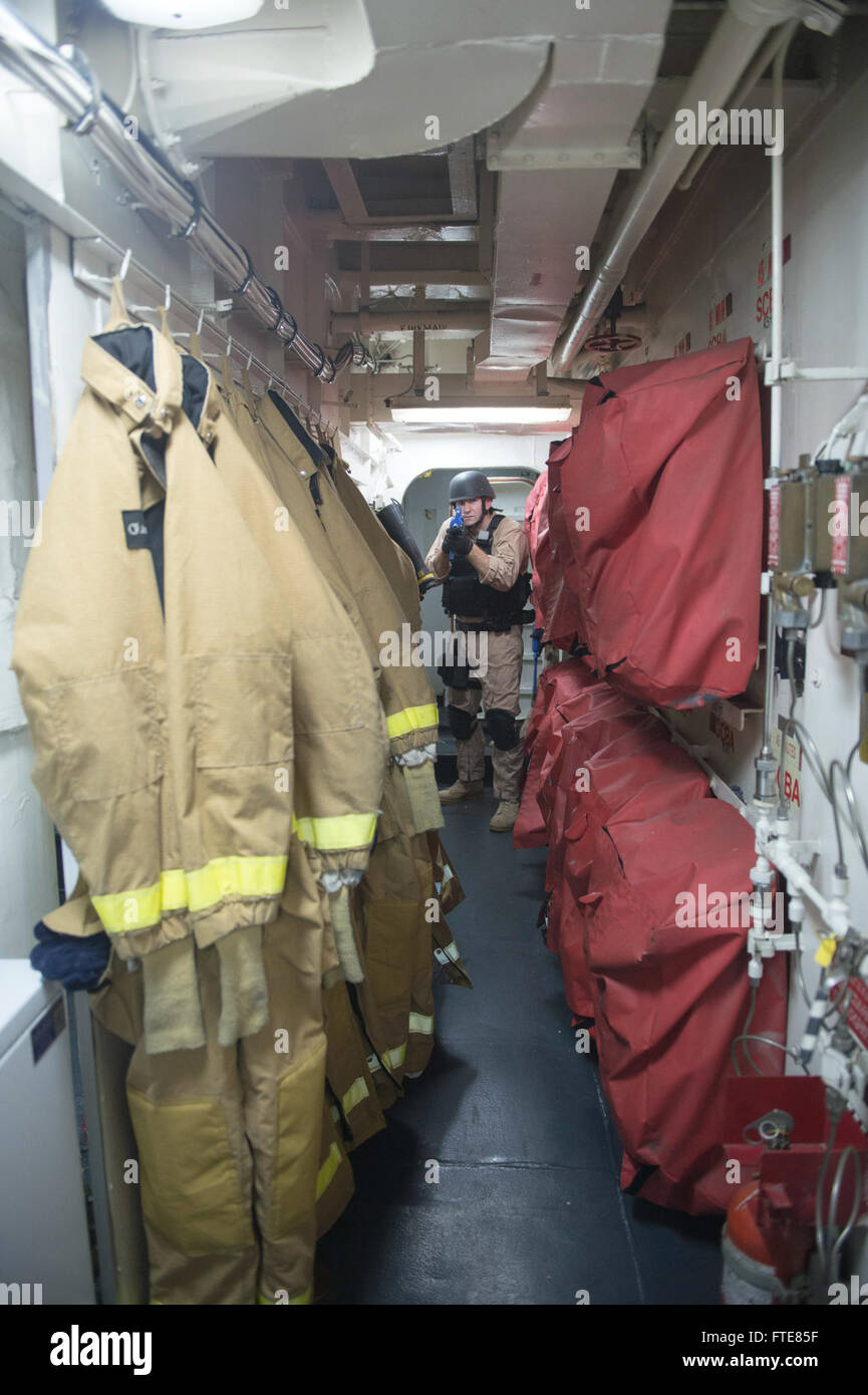 Ens. Carson Talley of the USS Stout (DDG 55) conducts a security sweep ...