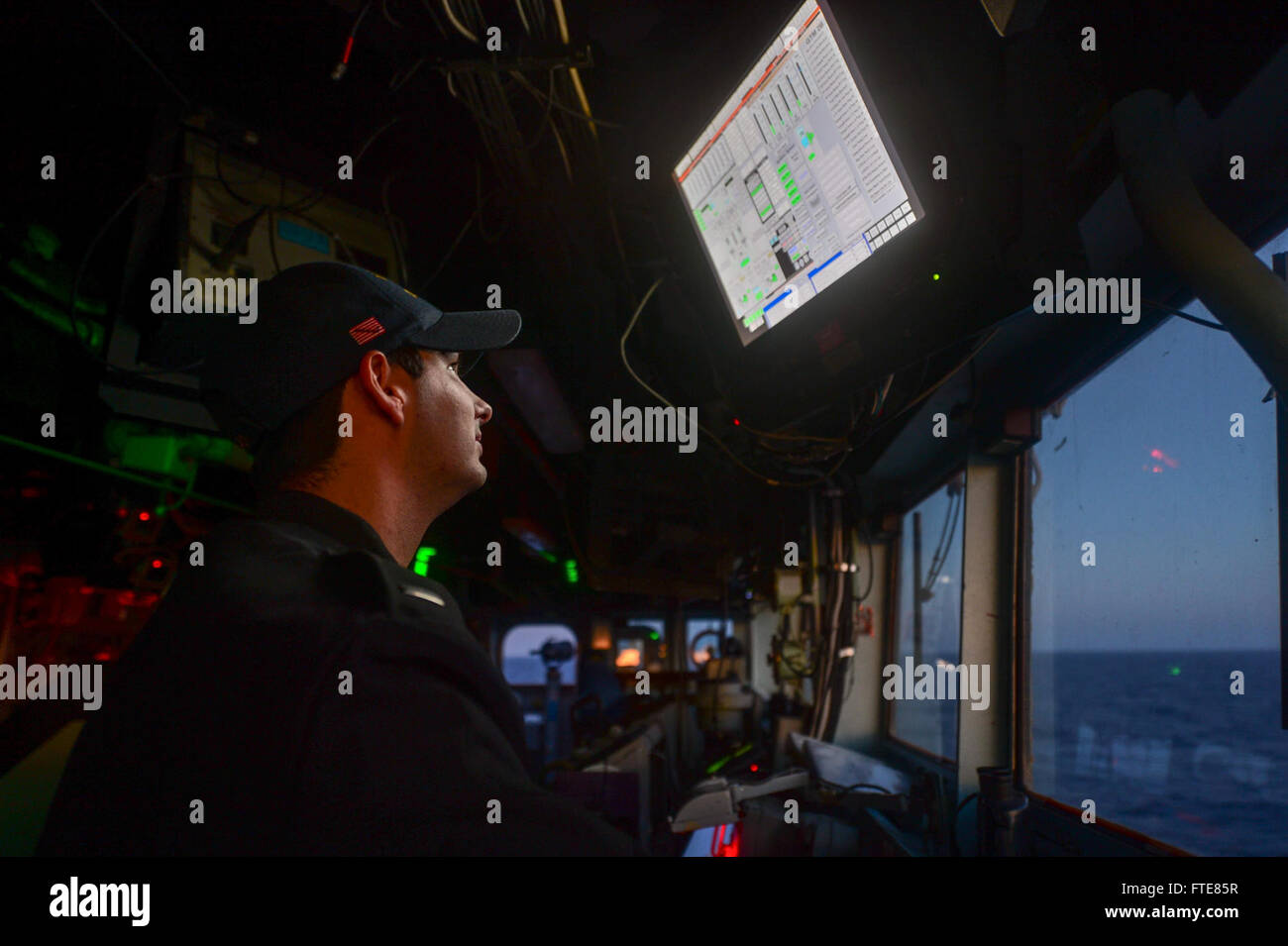 Lt. j.g. Brandon Pearson monitors the Human Machine Interface (HMI ...