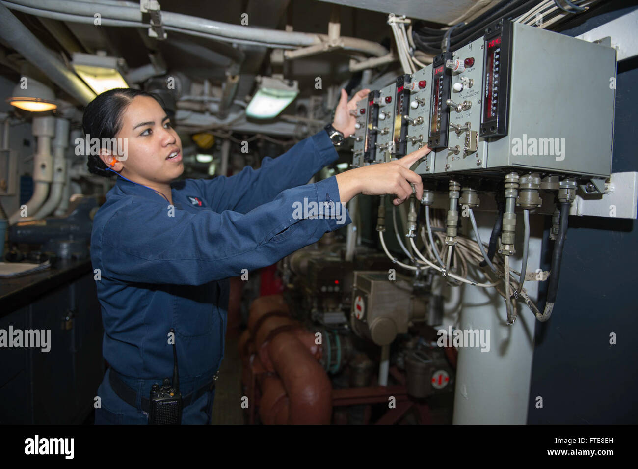 Engineman 2nd Class Cherrilyn Alonzo performs a critical water transfer ...