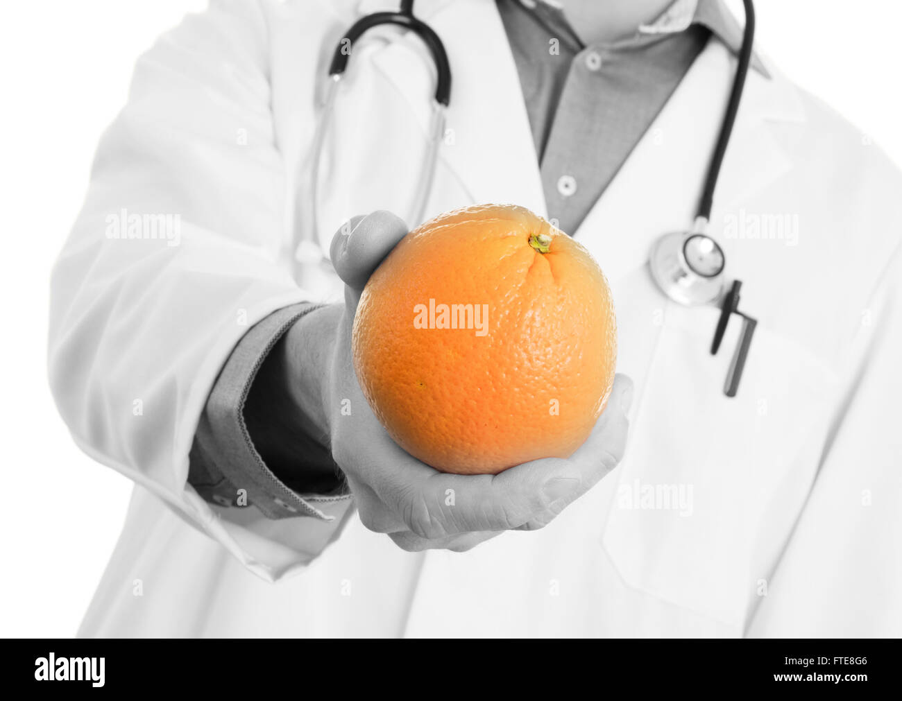 Nutritionist doctor, giving an orange, isolated on white Stock Photo ...