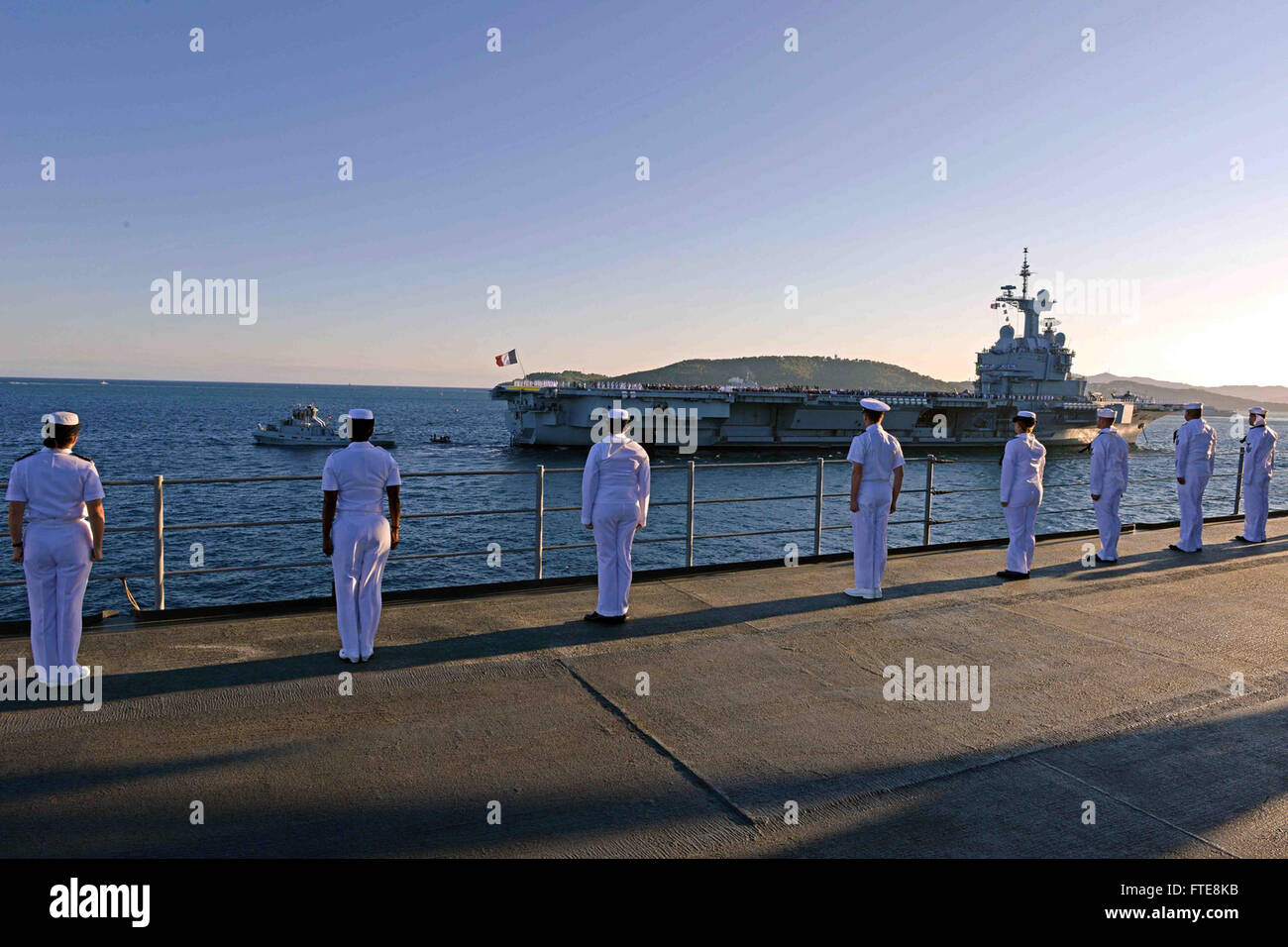 Sailors aboard the USS Mount Whitney (LCC 20) honor the aircraft ...