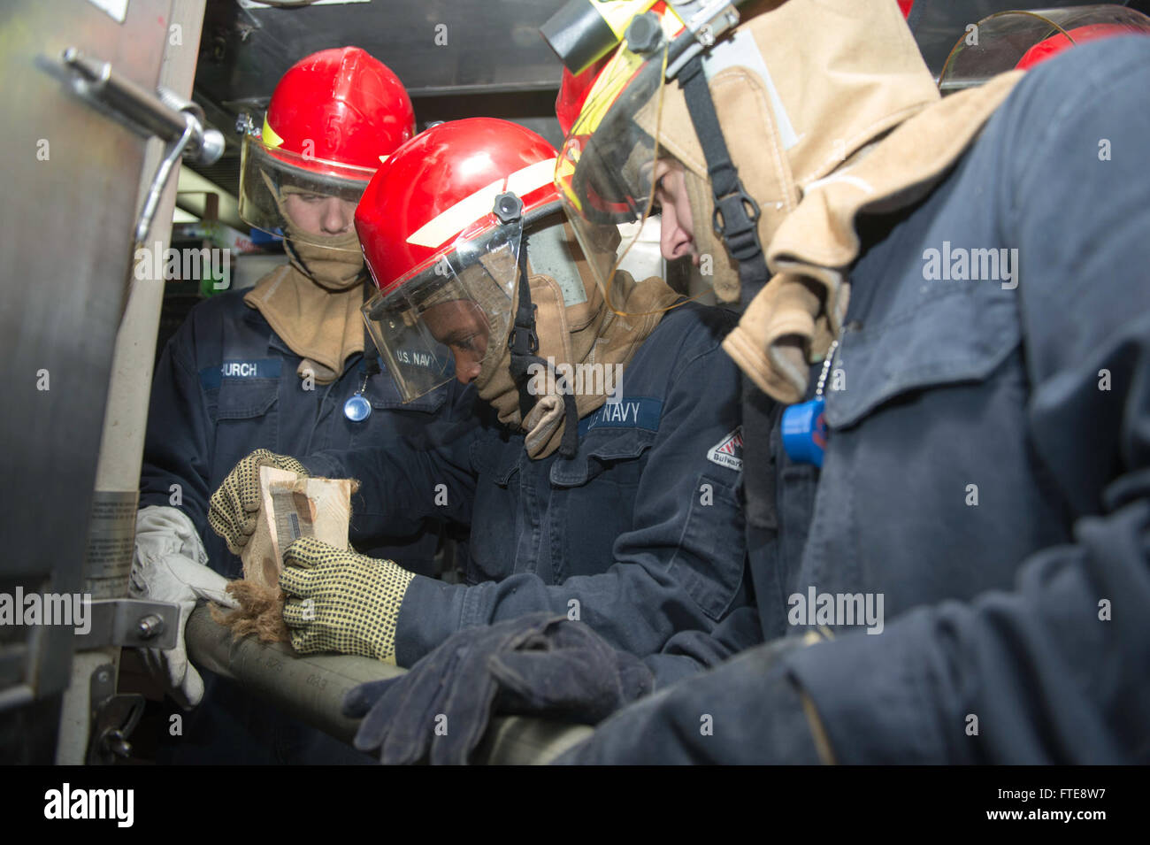 This photograph shows a damage control drill aboard the USS Stout (DDG ...