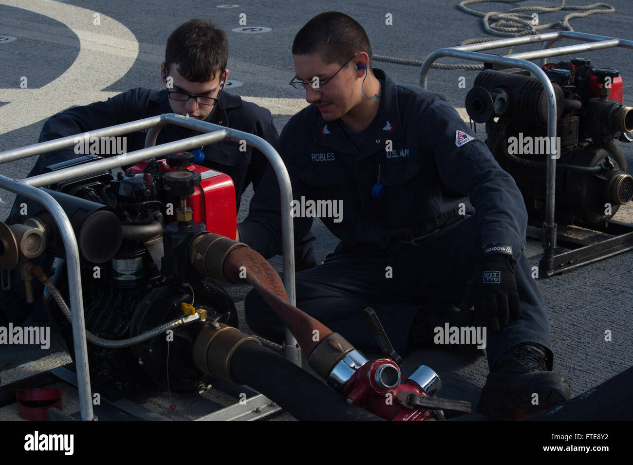 This image shows U.S. Navy Damage Controlmen aboard the USS Cole (DDG ...