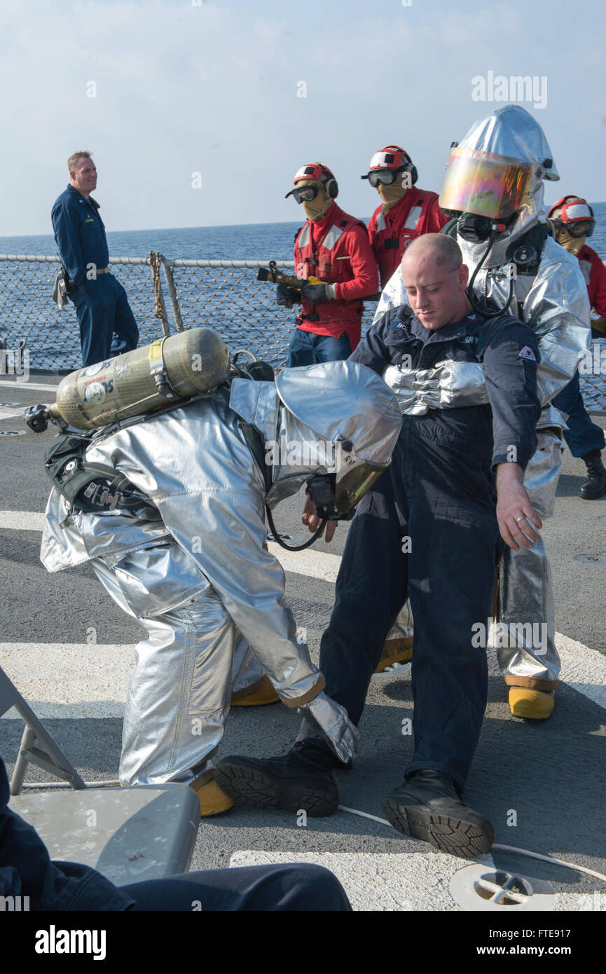 This U.S. Navy photo shows crew members conducting a helicopter crash ...