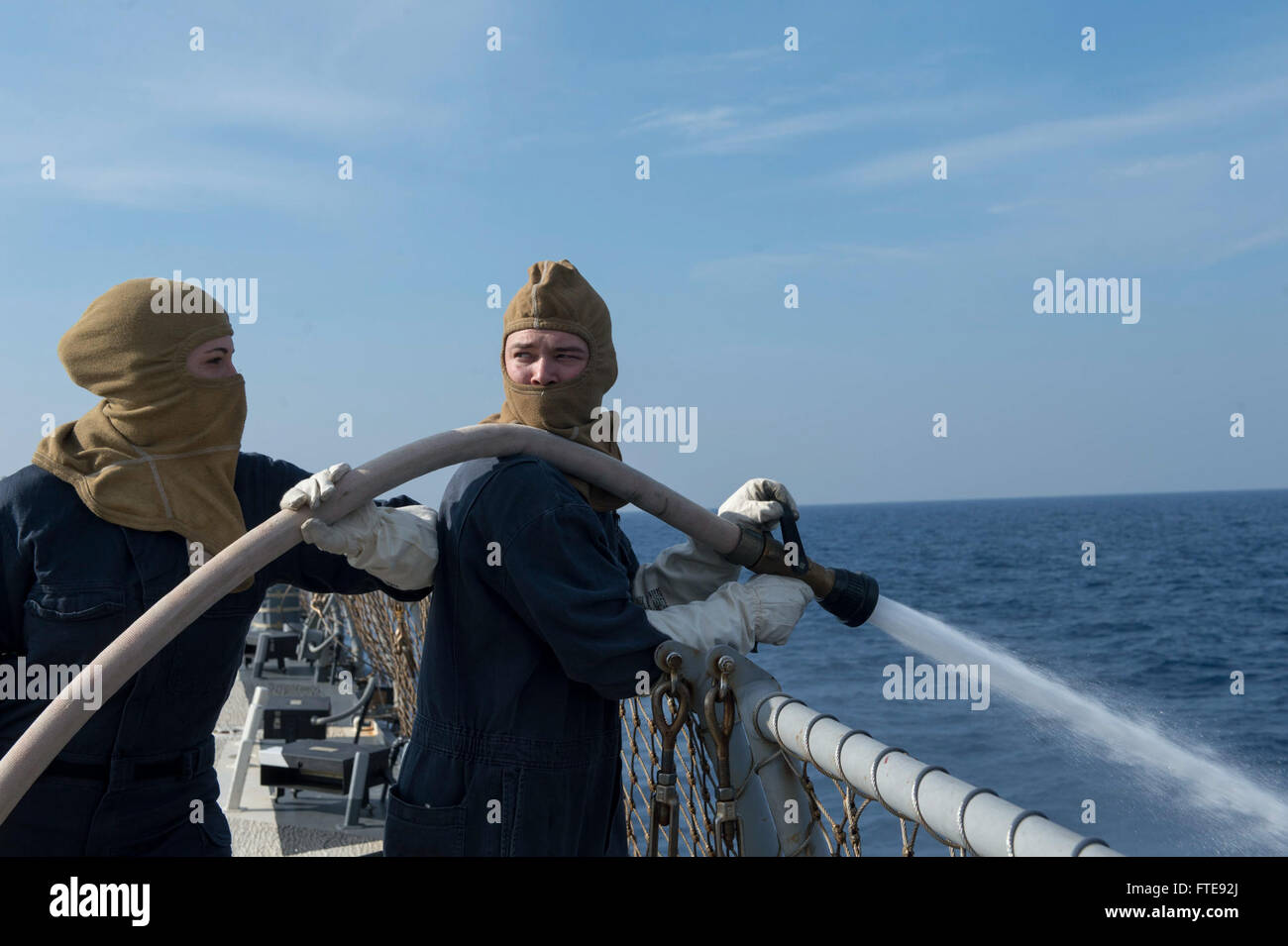 A U.S. Navy photo showing Machinery Repairman 2nd Class Robert Briggs ...