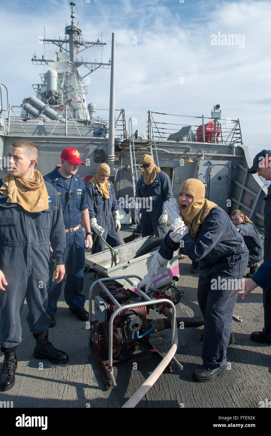 A sailor practices operating a P-100 pump during a damage control team ...