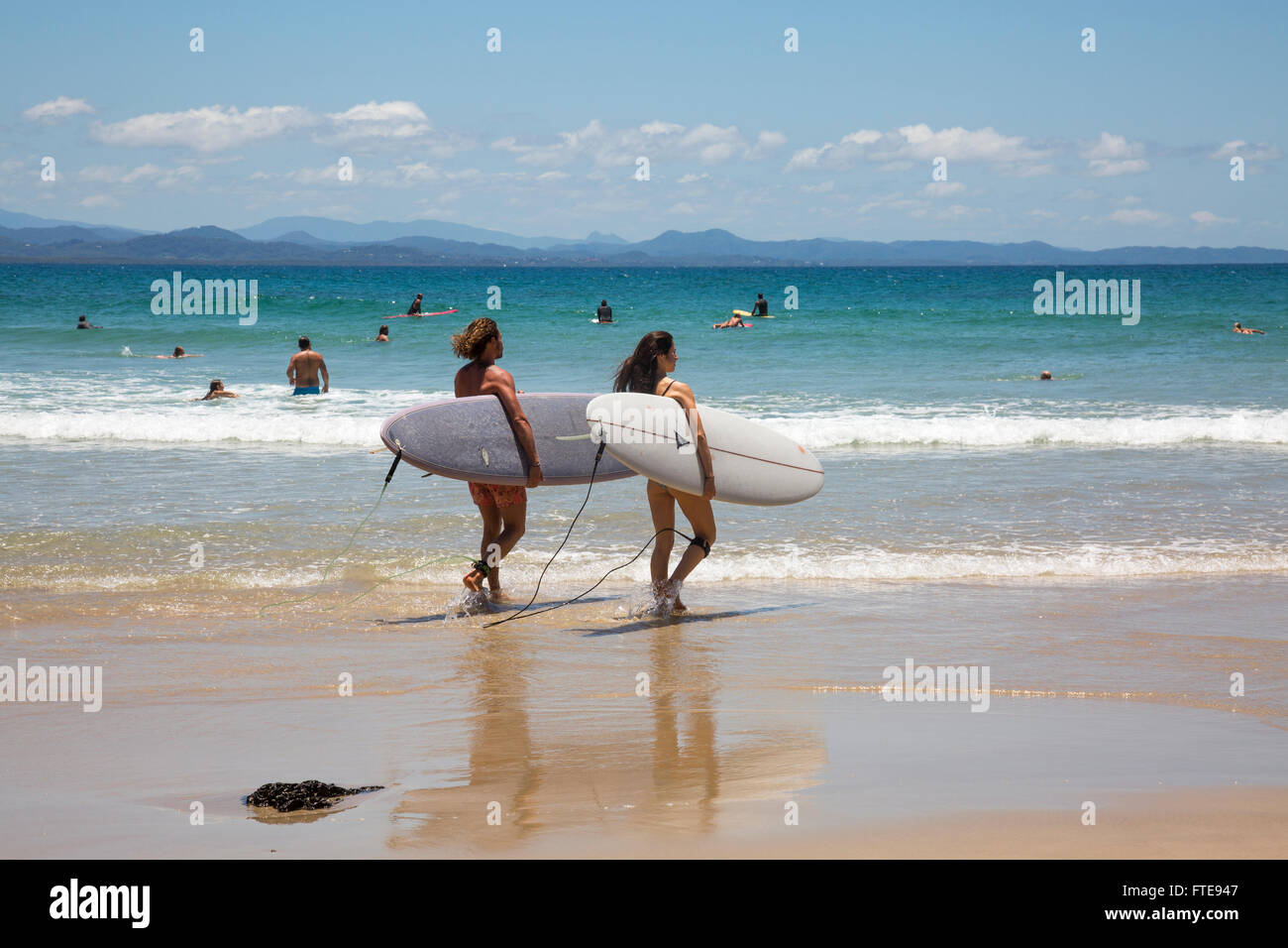 Male and female Surfers and beach goers on Wategos beach,Byron Bay,New ...