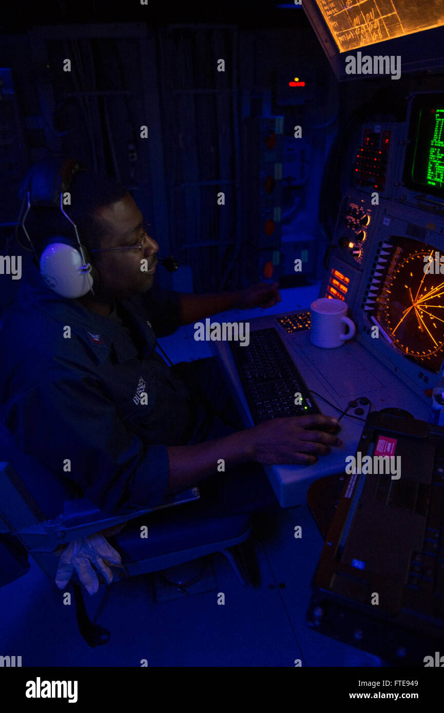 A photo shows *Fire Controlman 2nd Class Cedric Bussey* working in the ...