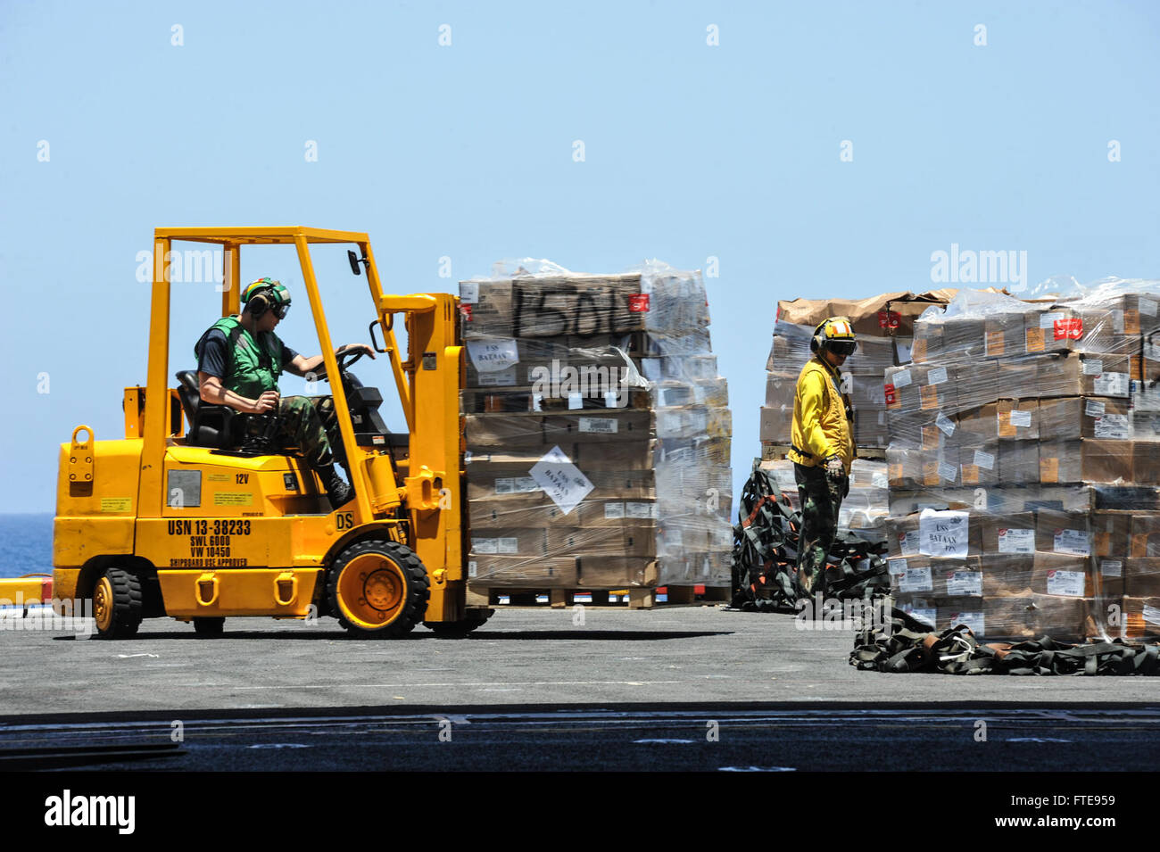 This U.S. Navy photo taken aboard USS Bataan (LHD 5) shows sailors ...