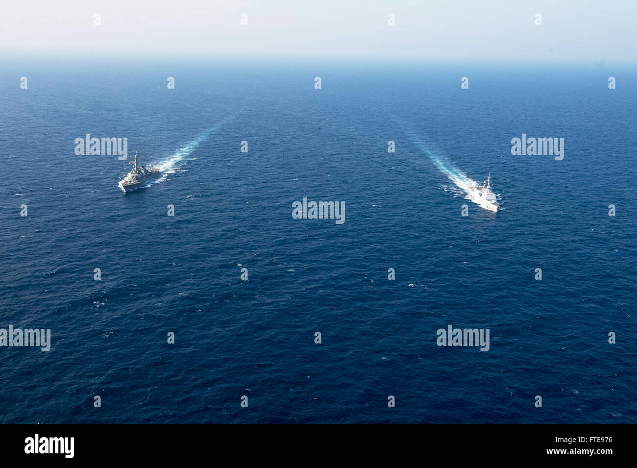 The Arleigh Burke-class guided-missile destroyer USS Stout (DDG 55) and ...