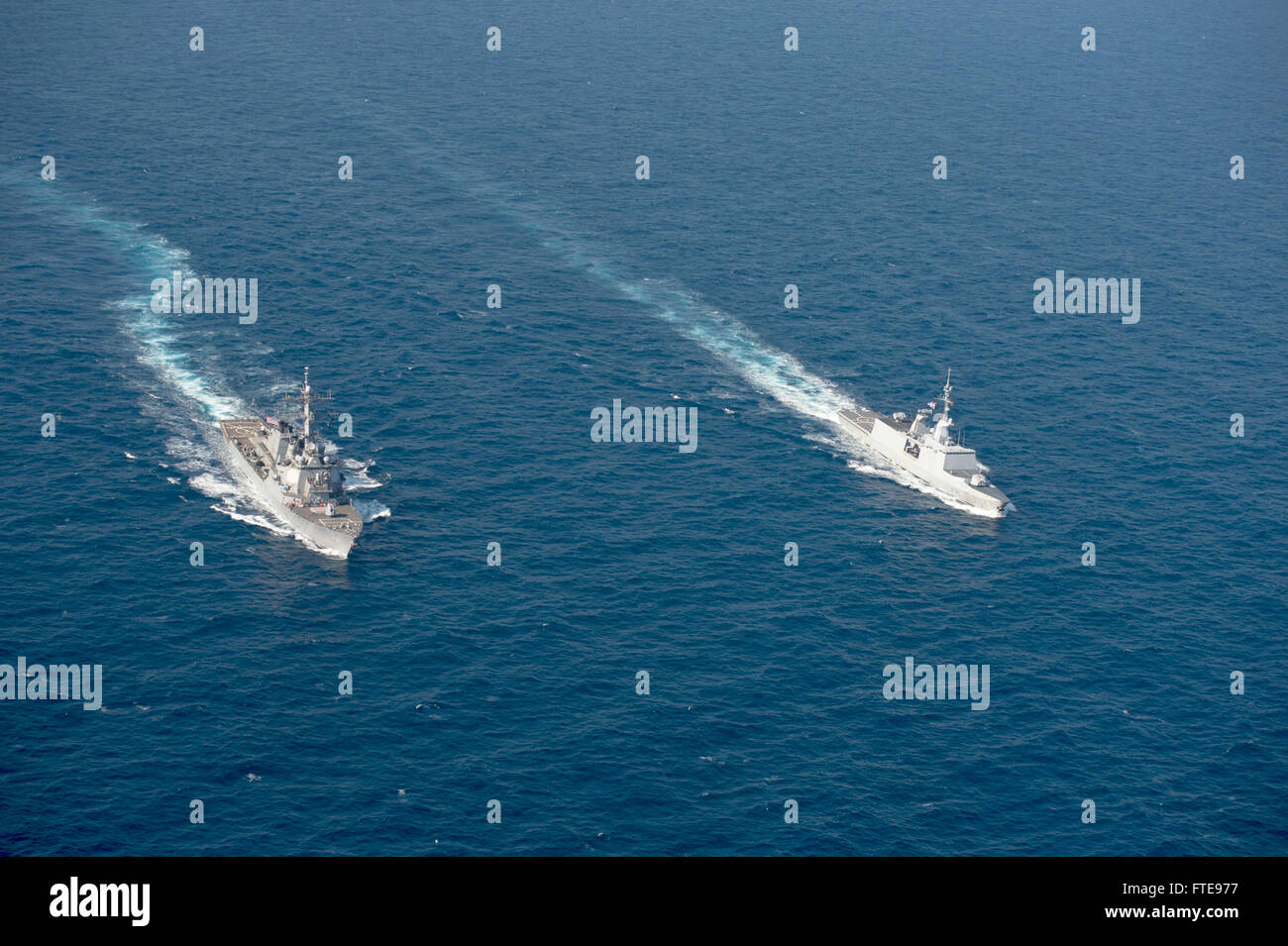 The Arleigh Burke-class guided-missile destroyer USS Stout (DDG 55) and ...