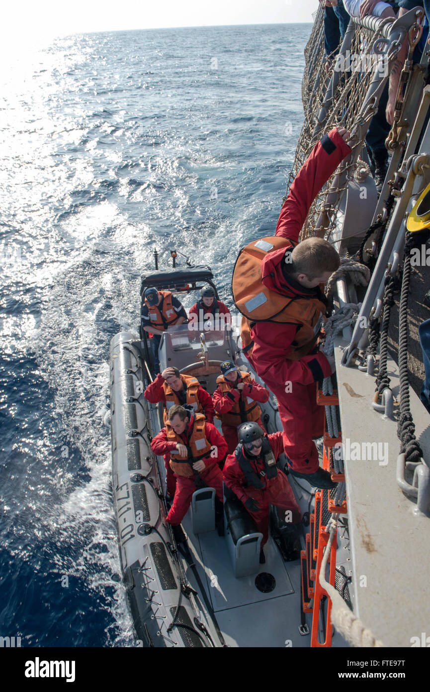 Sailors from the French Navy frigate FS Surcouf (F 711) descend onto a ...