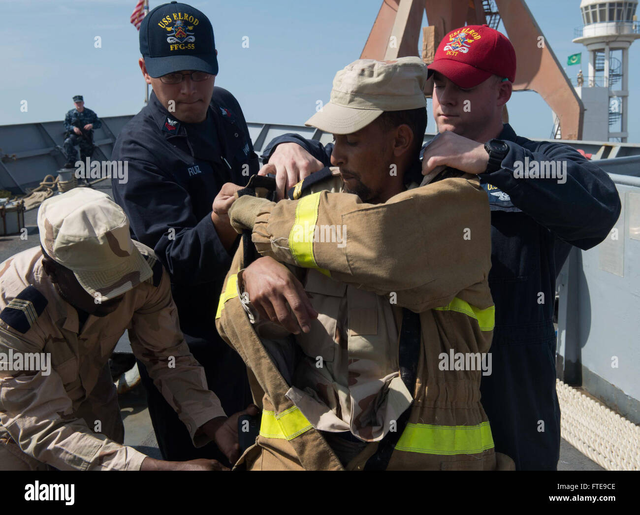 This photograph depicts Damage Controlman 1st Class Jose Ruiz and Chief ...