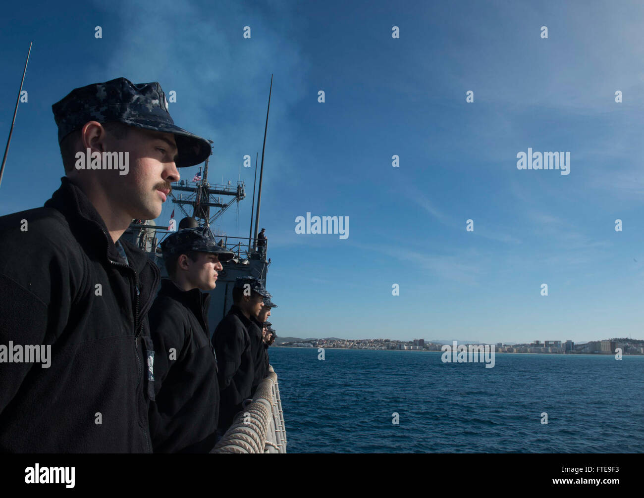 The image shows sailors aboard the USS Elrod (FFG 55), an Oliver Hazard ...
