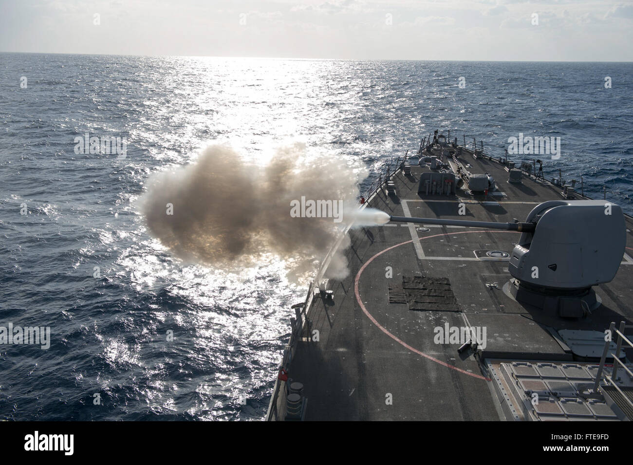 A round is fired from the Mk-45 5-inch gun aboard USS Stout (DDG 55 ...