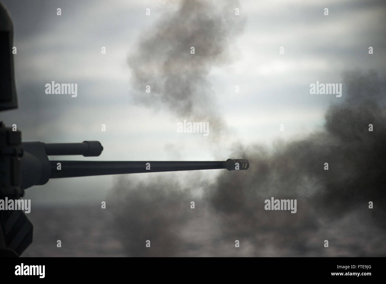 Sailors aboard the USS Donald Cook conduct a live fire exercise in the ...