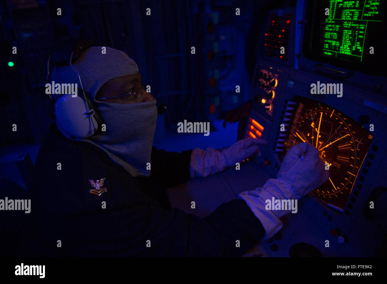 A U.S. Navy Fire Controlman aboard the USS Stout monitors radar systems ...