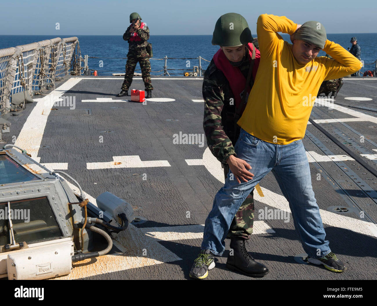 During a passing exercise aboard the USS Elrod (FFG 55), a member of ...