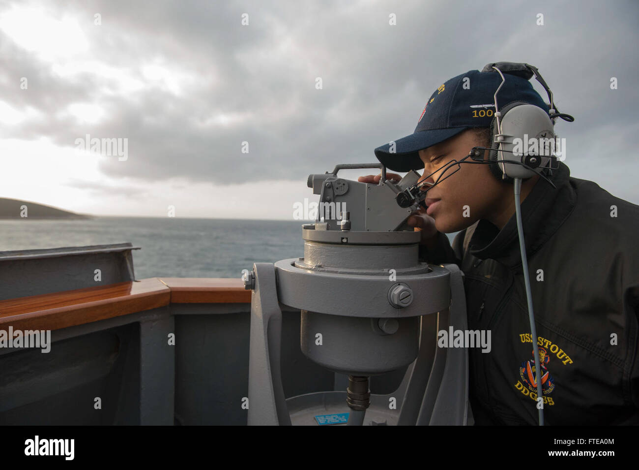 Quartermaster Seaman Recruit Tayler Simpkins takes a bearing aboard the ...