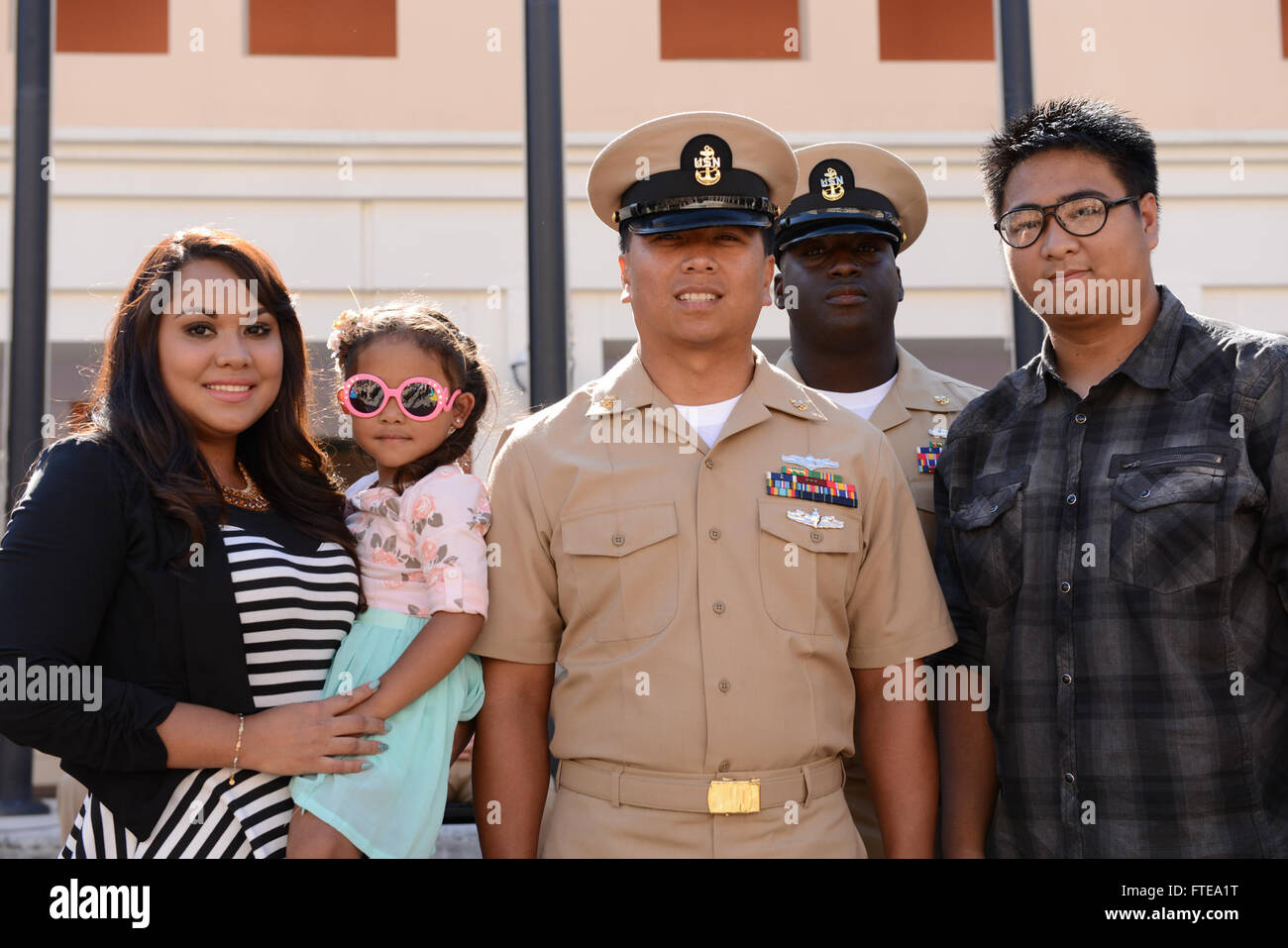 This image captures a ceremonial moment during the U.S. Navy's Chief ...