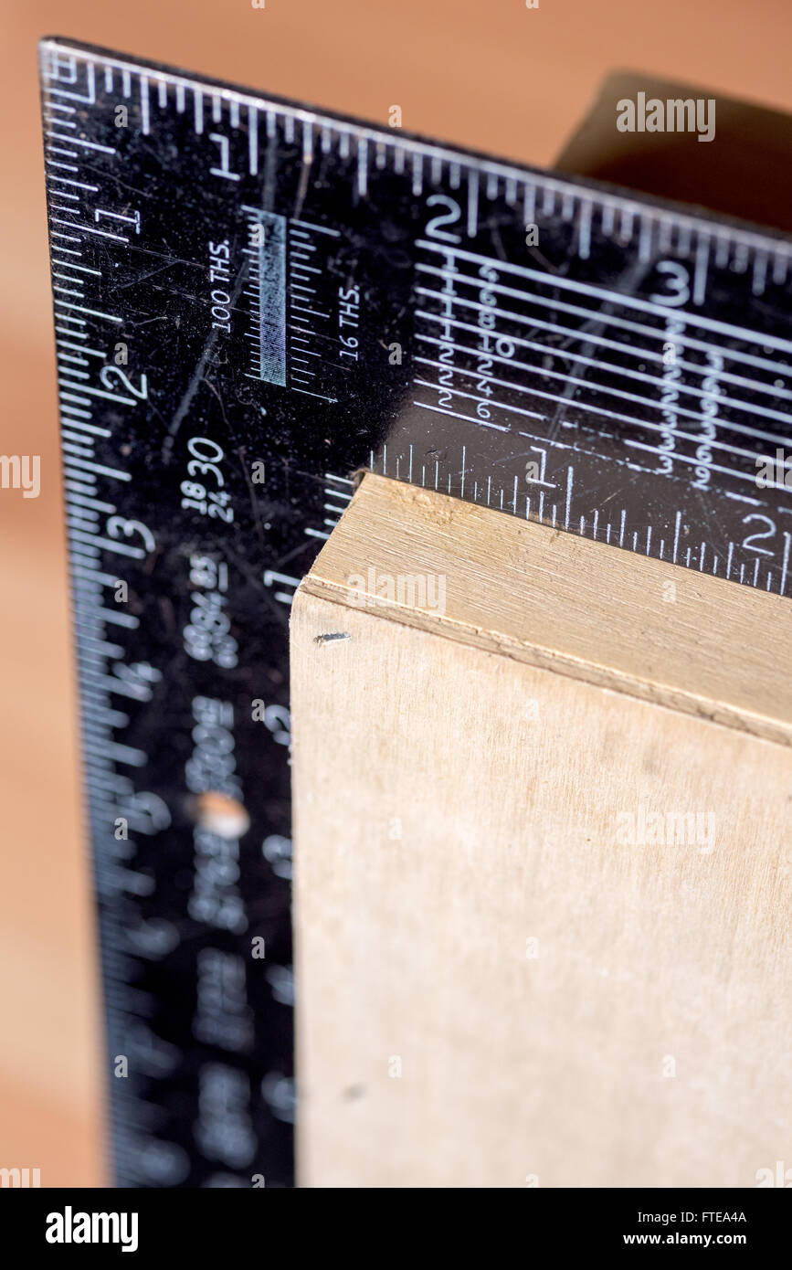 Carpenters square on a wooden box Stock Photo - Alamy