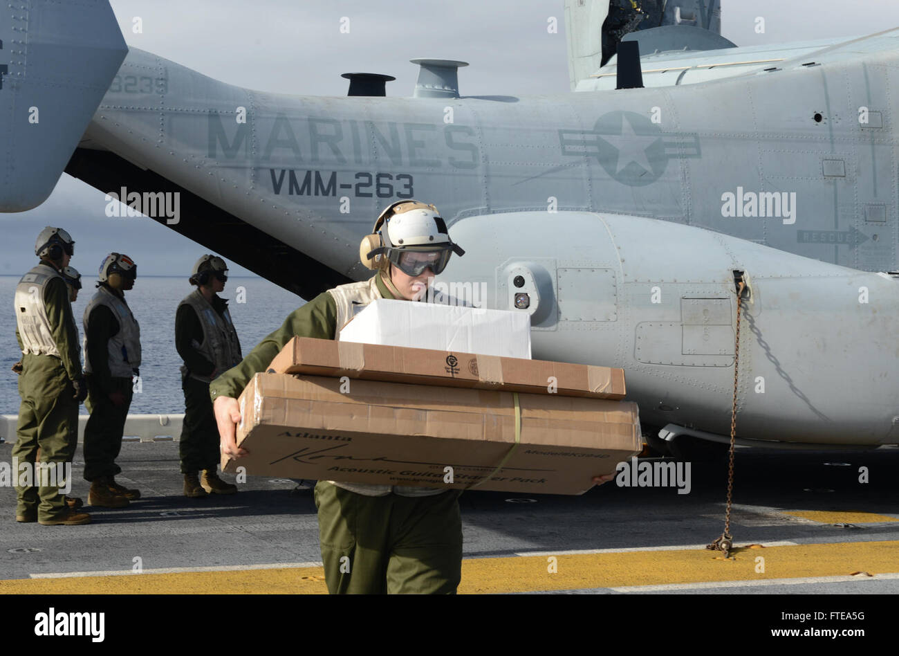 Marines aboard the USS Bataan (LHD 5) receive their first mail delivery ...