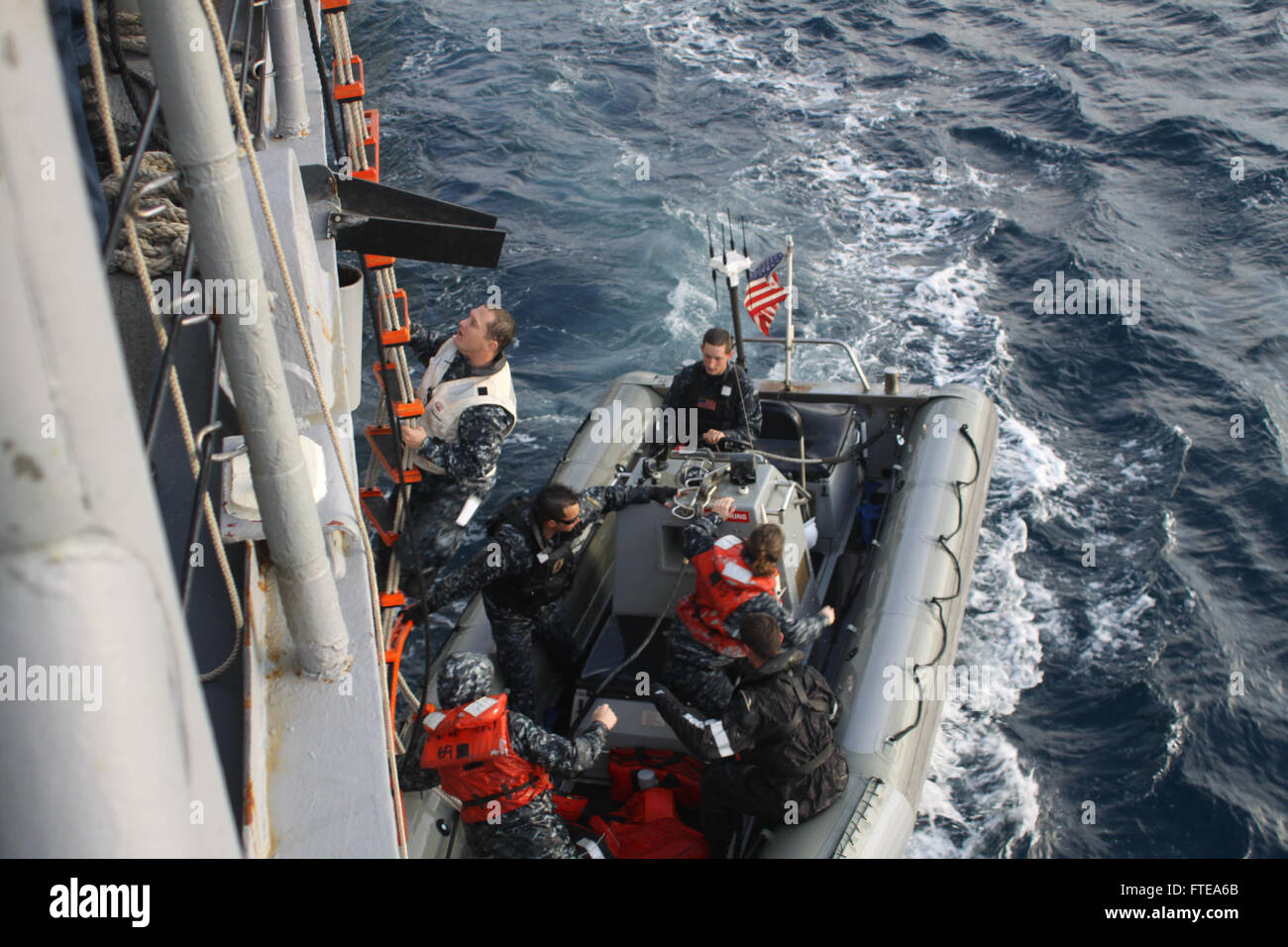 This U.S. Navy photo captures sailors aboard the USS Elrod (FFG 55 ...