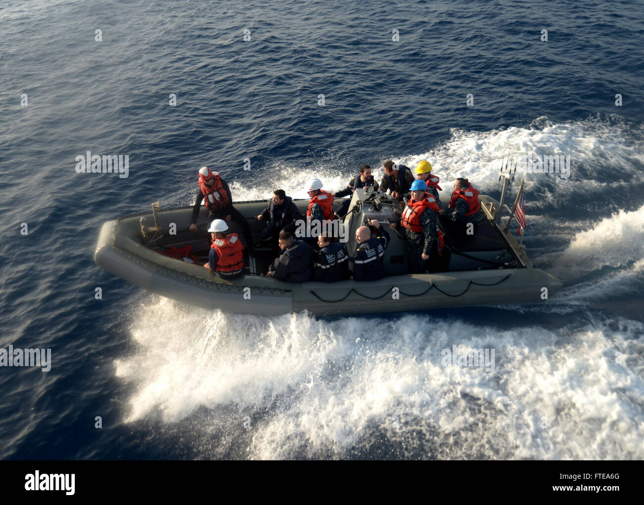 On February 22, 2014, sailors aboard the USS Ramage (DDG 61) conduct a ...