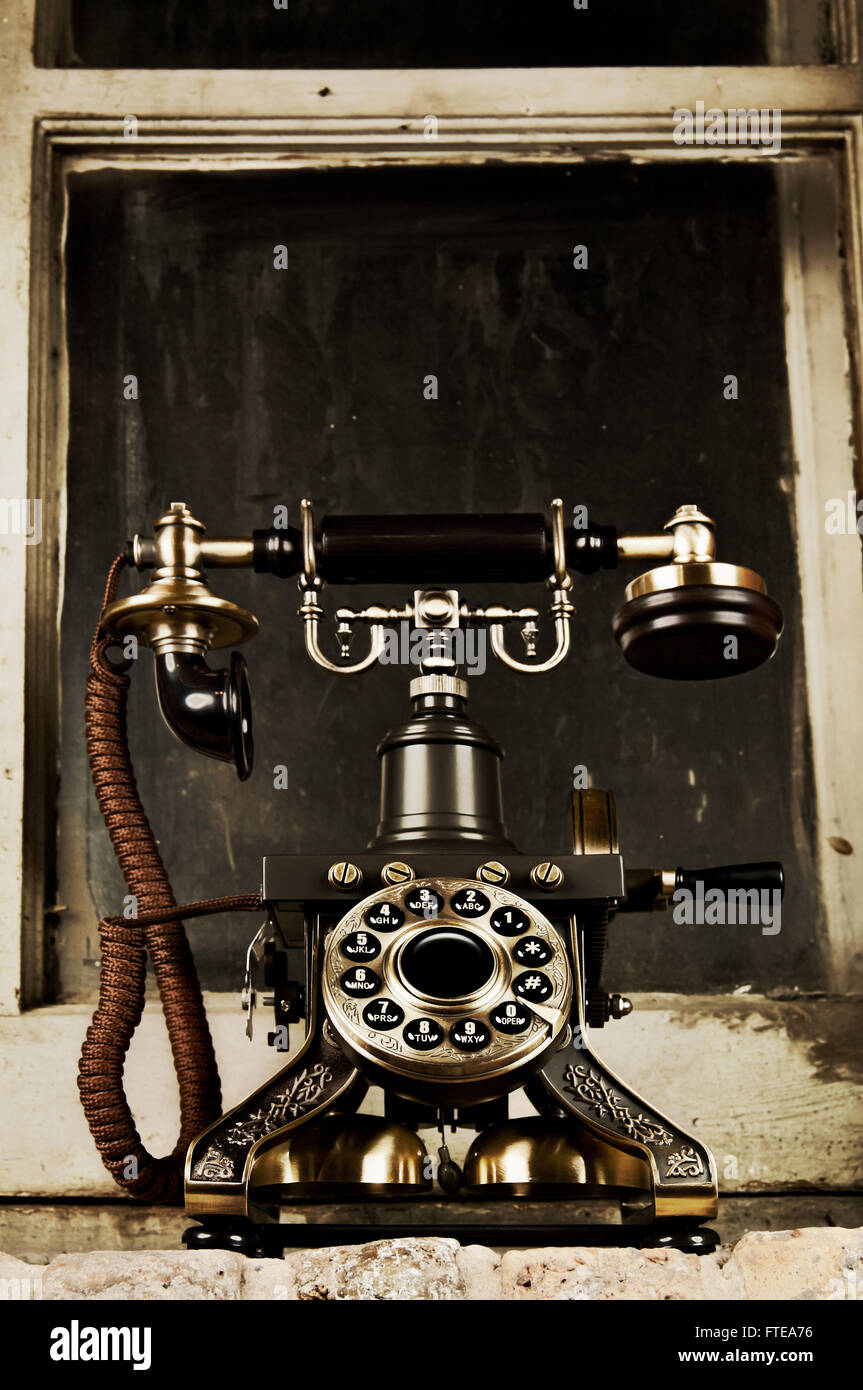 Retro Phone - Vintage Telephone by Old Grunge Window Stock Photo - Alamy